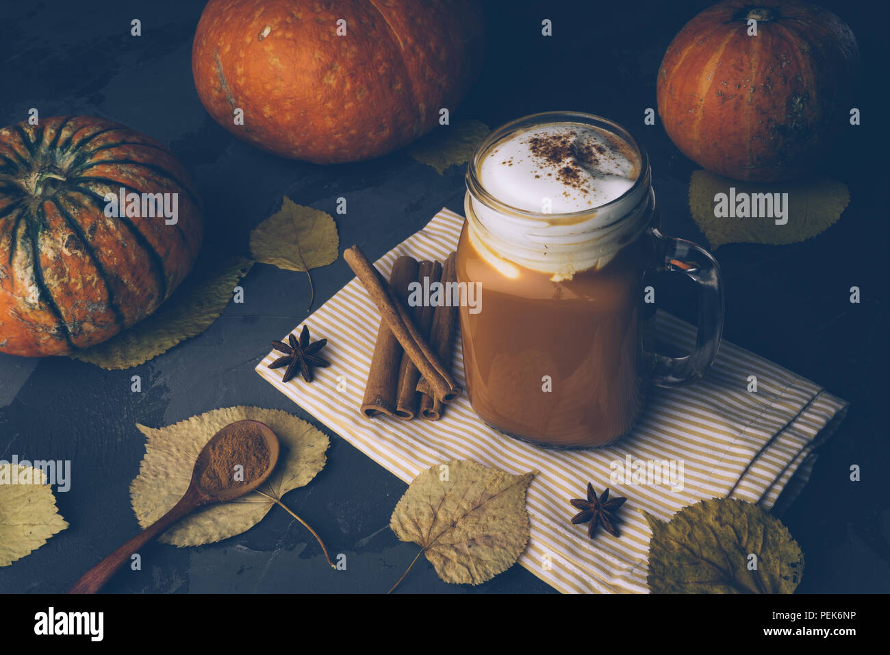 Pumpkin spice latte or coffee with cinnamon. Autumn, fall or winter hot ...