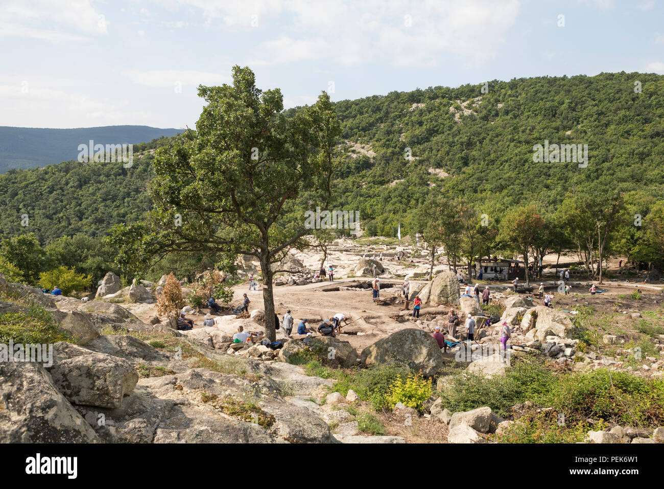 Workers digging at ancient excavation site with Thracian and Greek ...