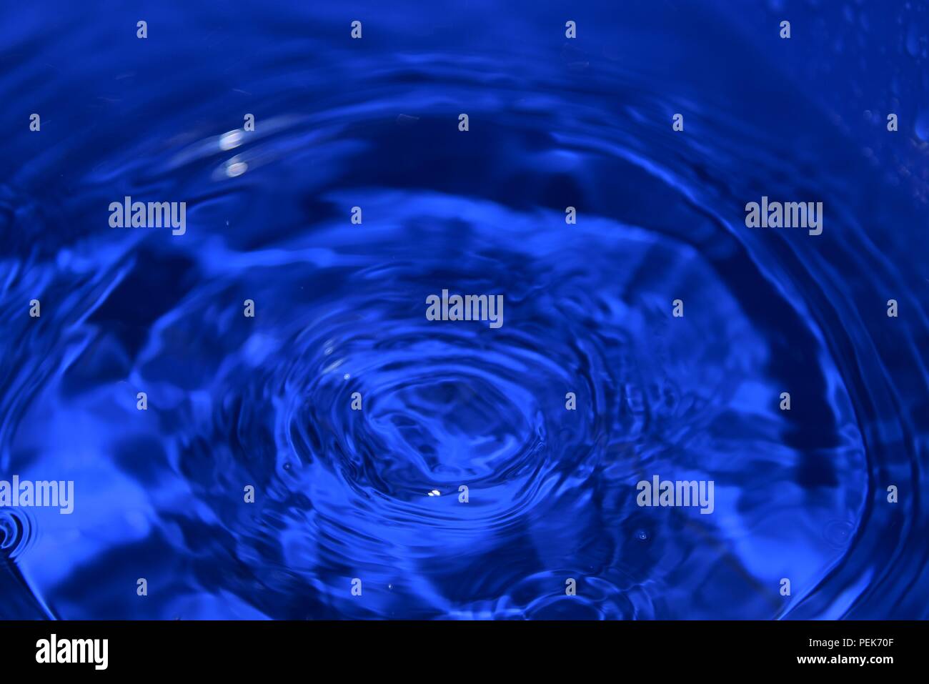 Abstract of a drop of water in a bucket Stock Photo - Alamy