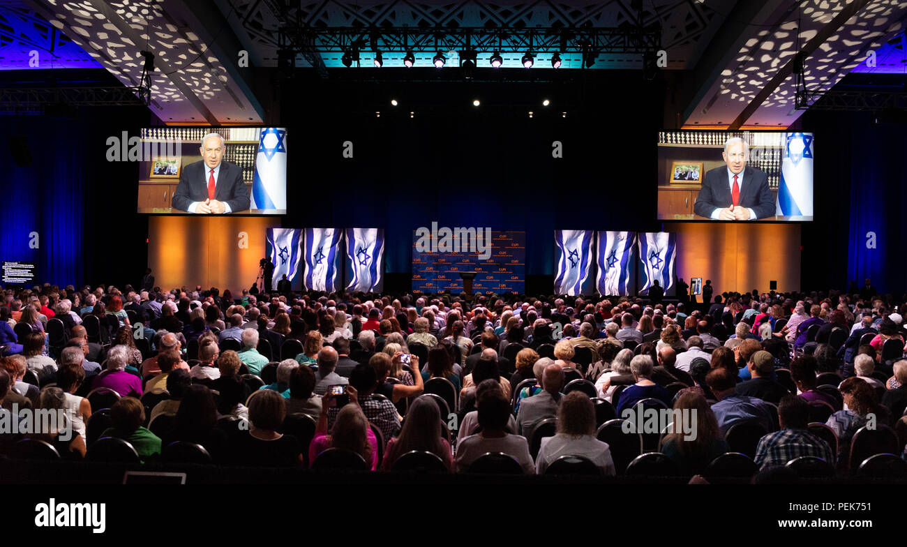 Benjamin Netanyahu, Prime Minister of Israel, speaking via live video ...