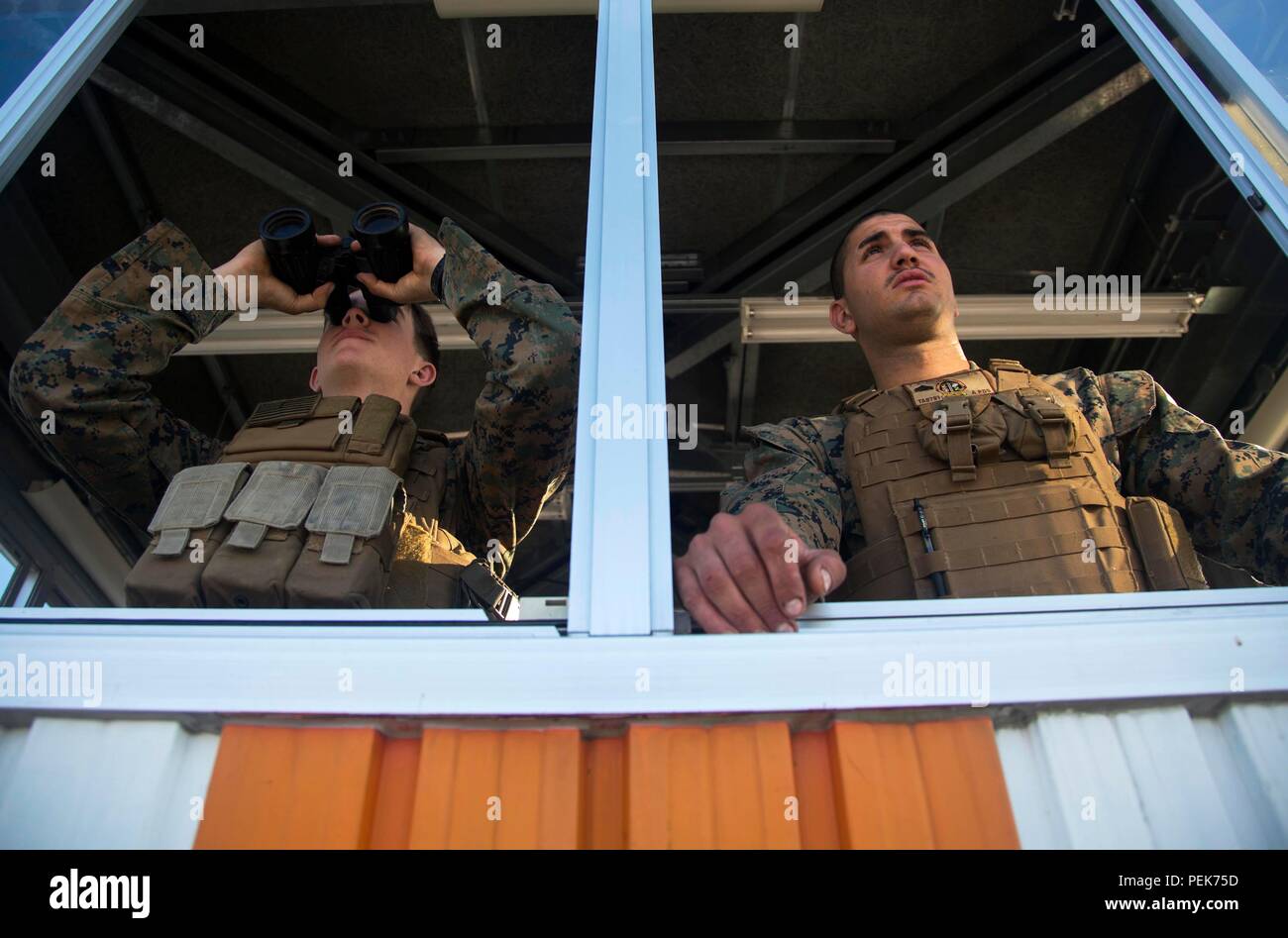 U.S. Marine Corps Cpl. Phillip J. Greene, left, a fire support team ...