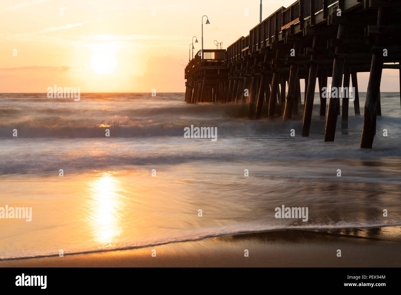 The waves splash along the Sandbridge Fishing Pier in Sandbridge ...