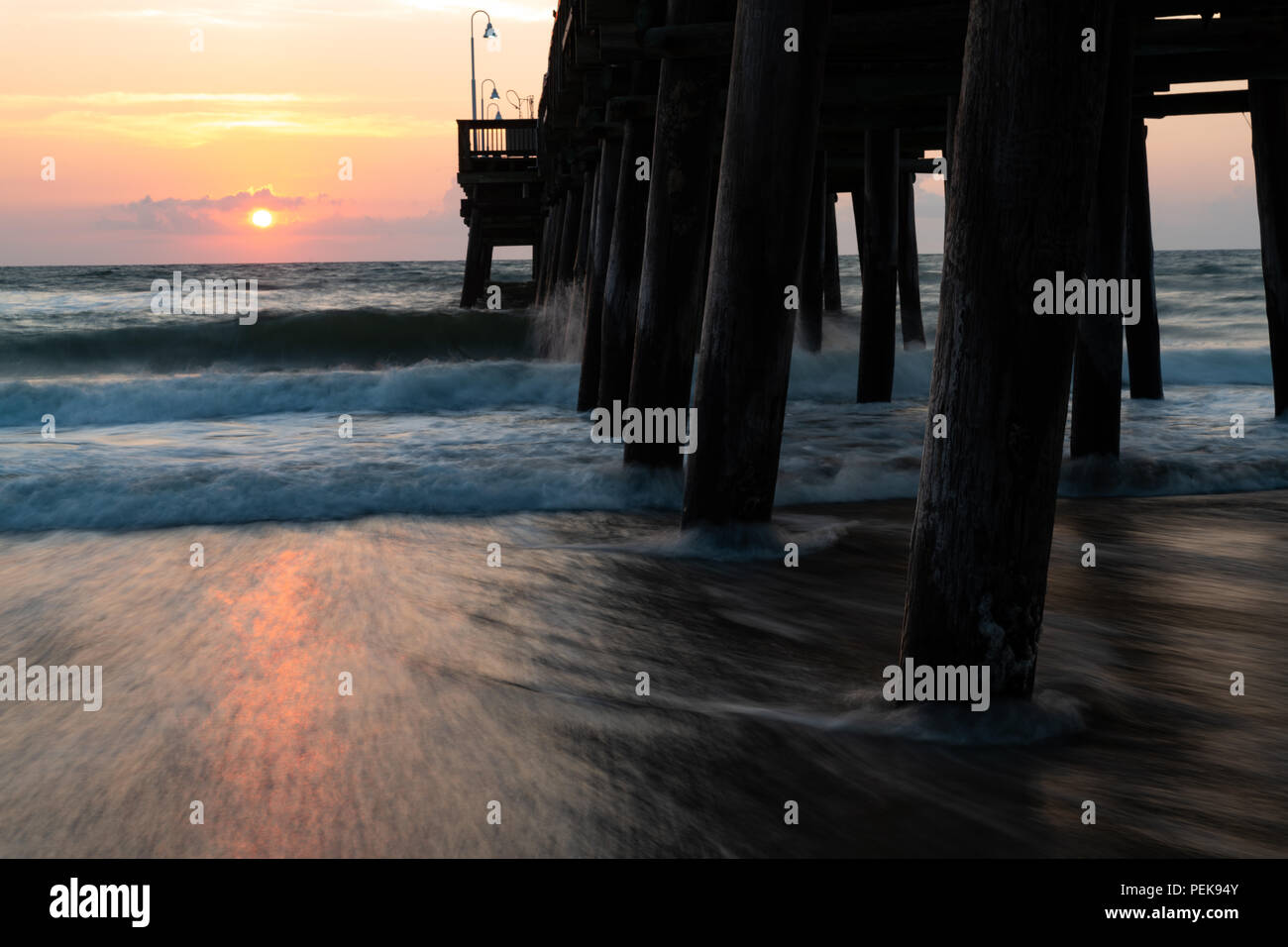 The waves splash along the Sandbridge Fishing Pier in Sandbridge ...