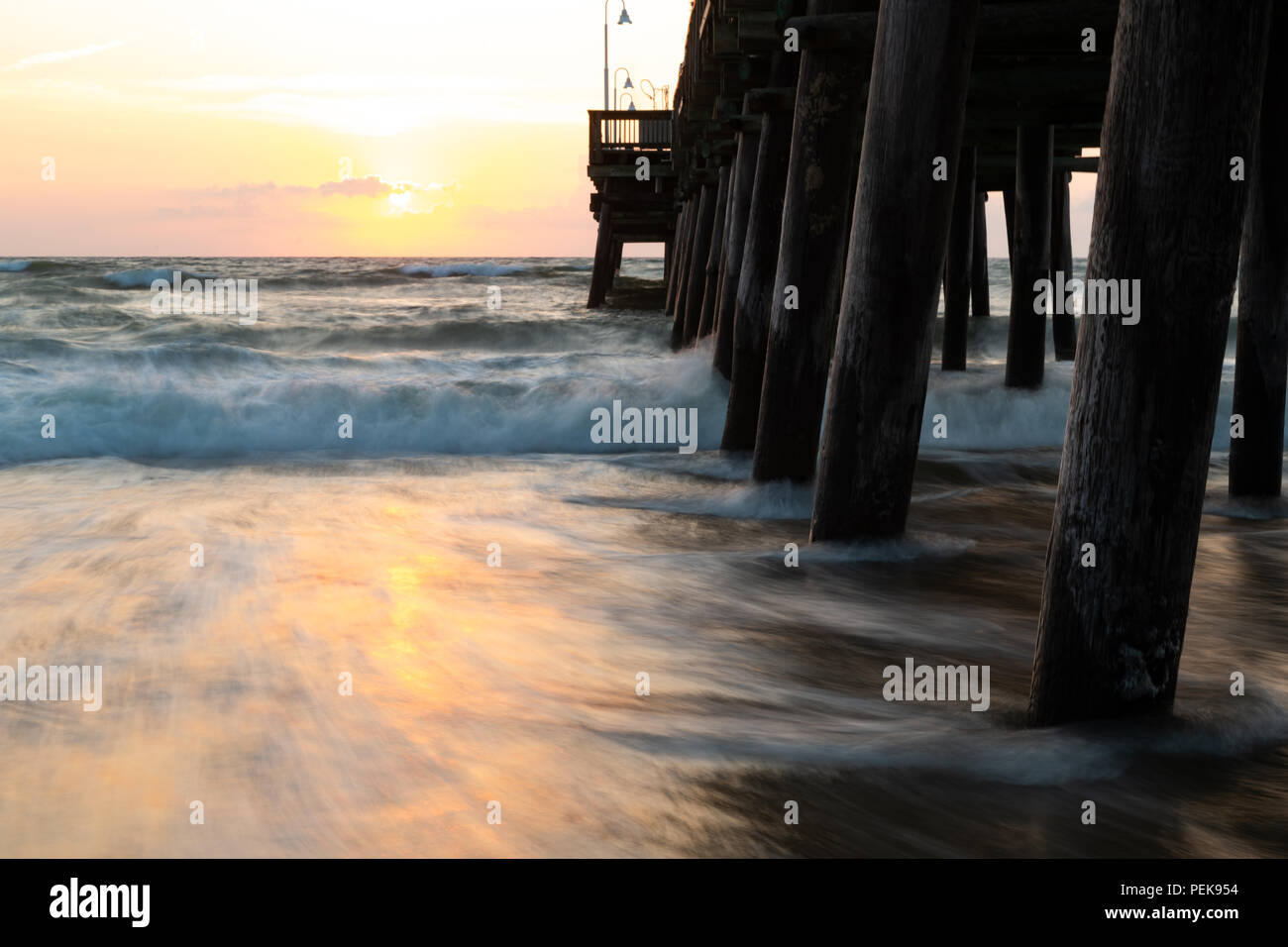 The waves splash along the Sandbridge Fishing Pier in Sandbridge ...