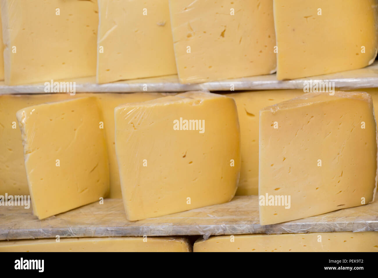 cuts of kashkaval or kasseri cheese for sale on the shelf Stock Photo ...