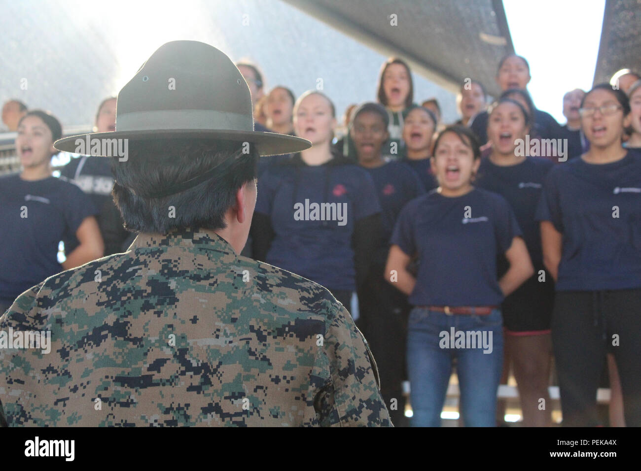 Marine enlistees meet Marine Corps drill instructors during a pool ...