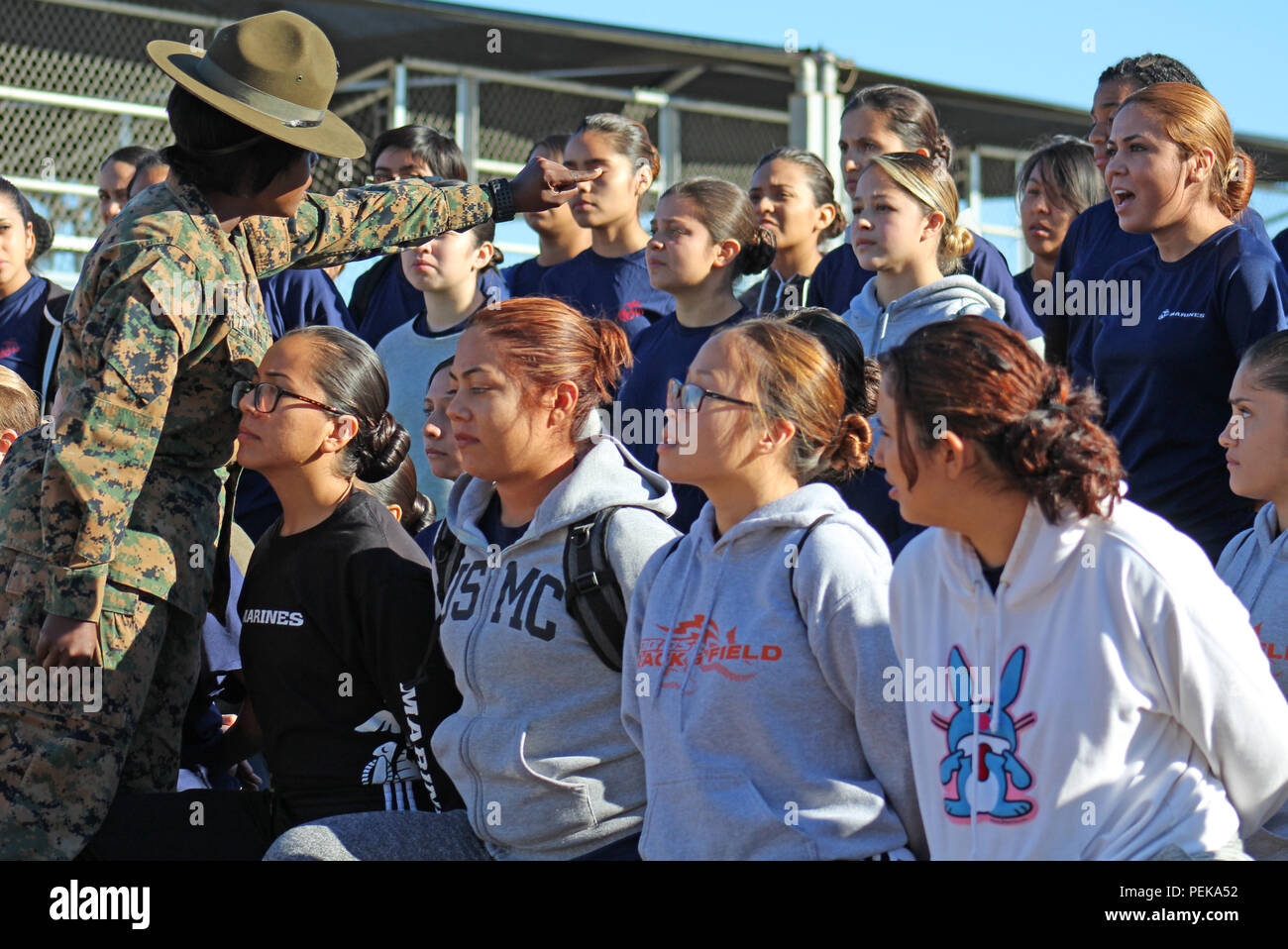 Drill Instructor Staff Sgt. Maria S. Zalwango, corrects a Marine ...