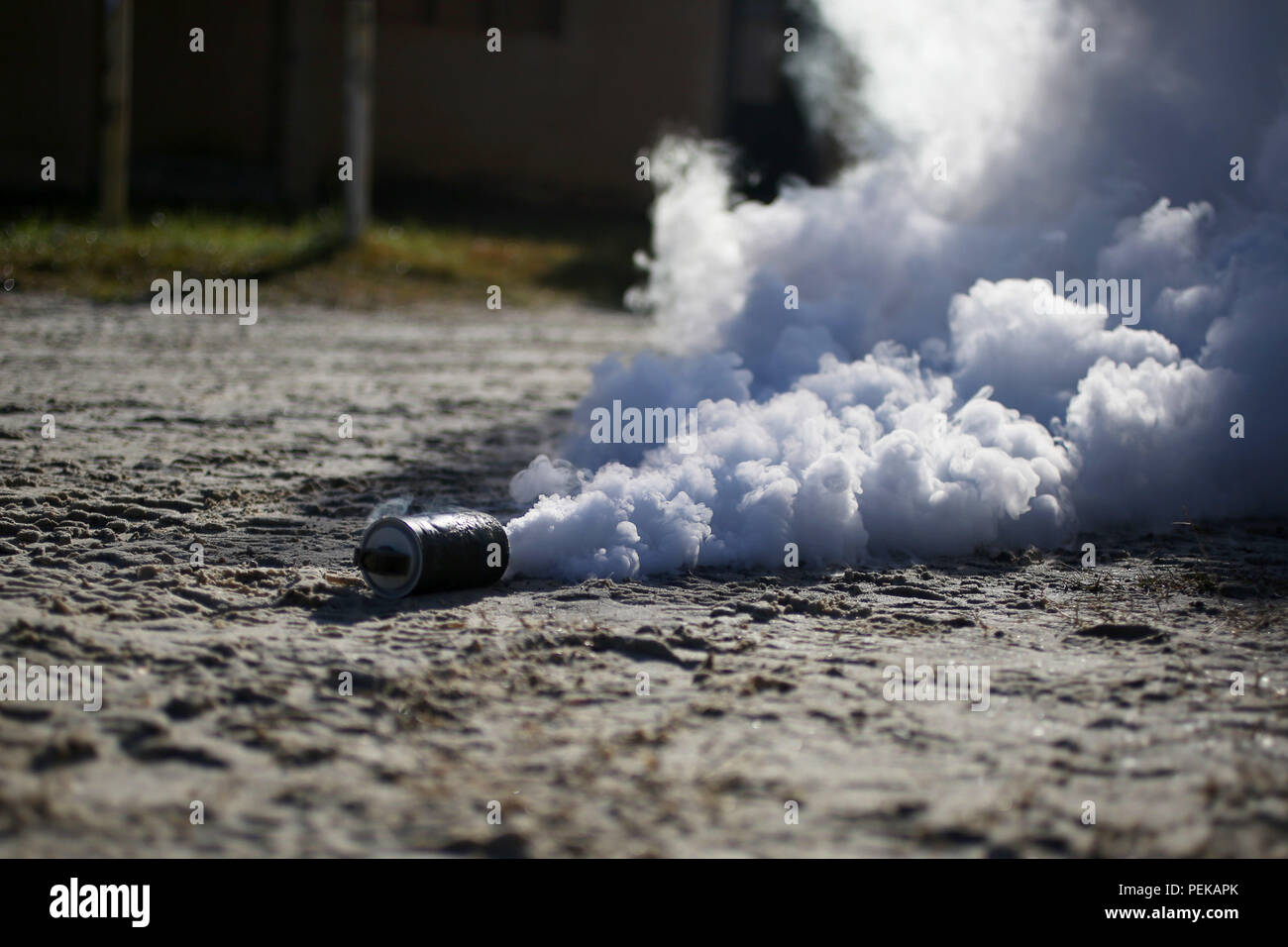 A smoke grenade is used to simulate a visual signal that the ...