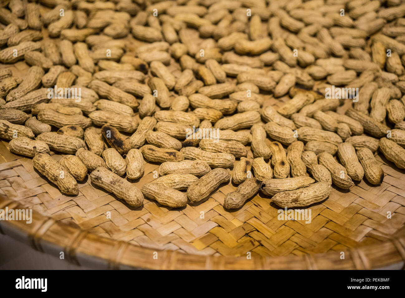 Fried and Dried Peanuts in a Bamboo Tray Stock Photo - Alamy