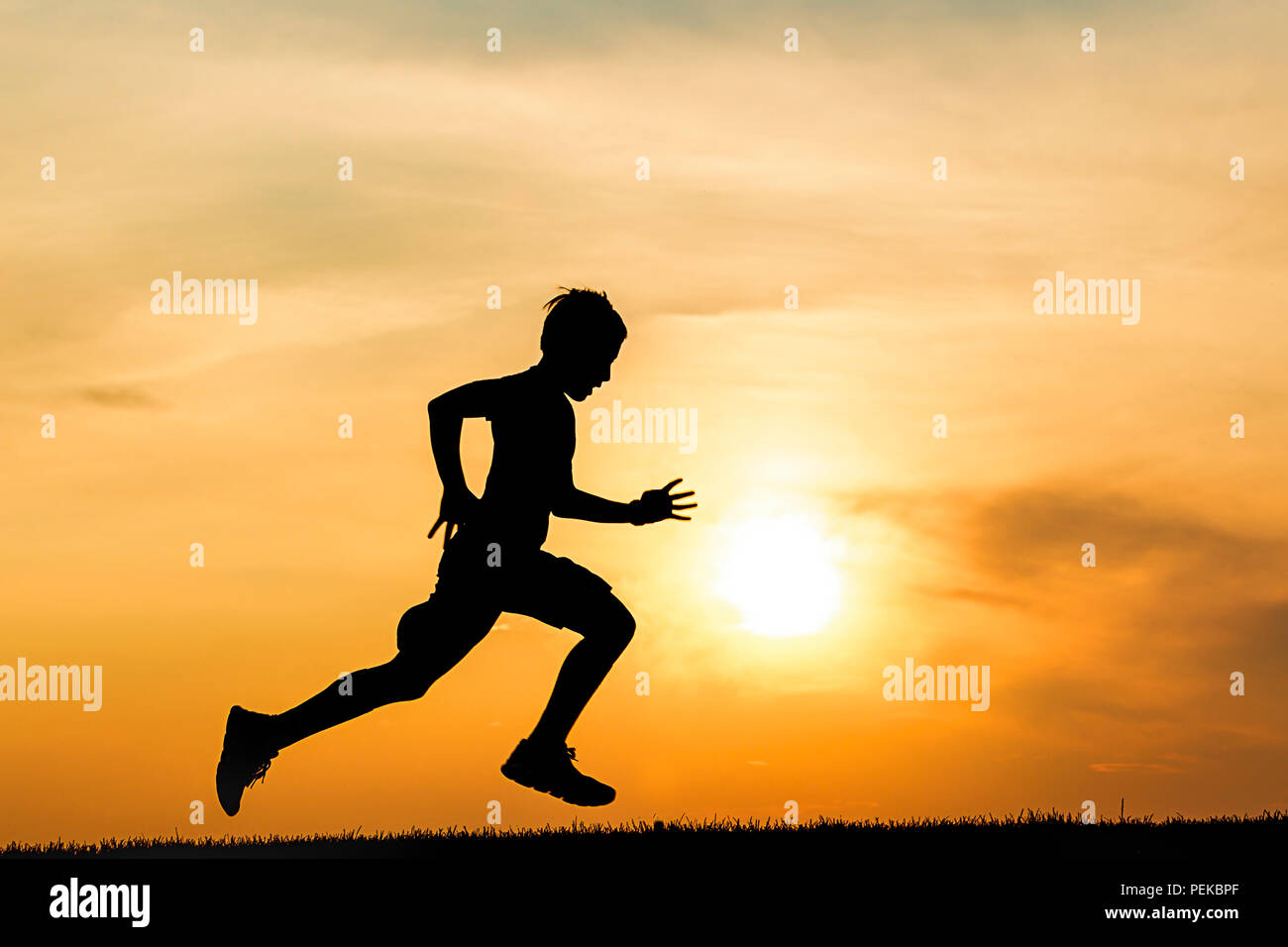 Boy running silhouette hi-res stock photography and images - Alamy