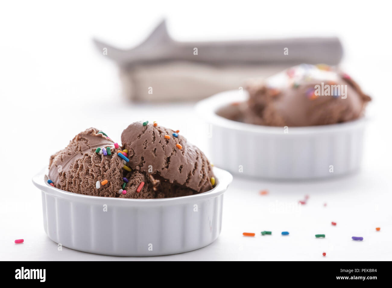 Two bowls of chocolate ice cream with candy sprinkles Stock Photo - Alamy