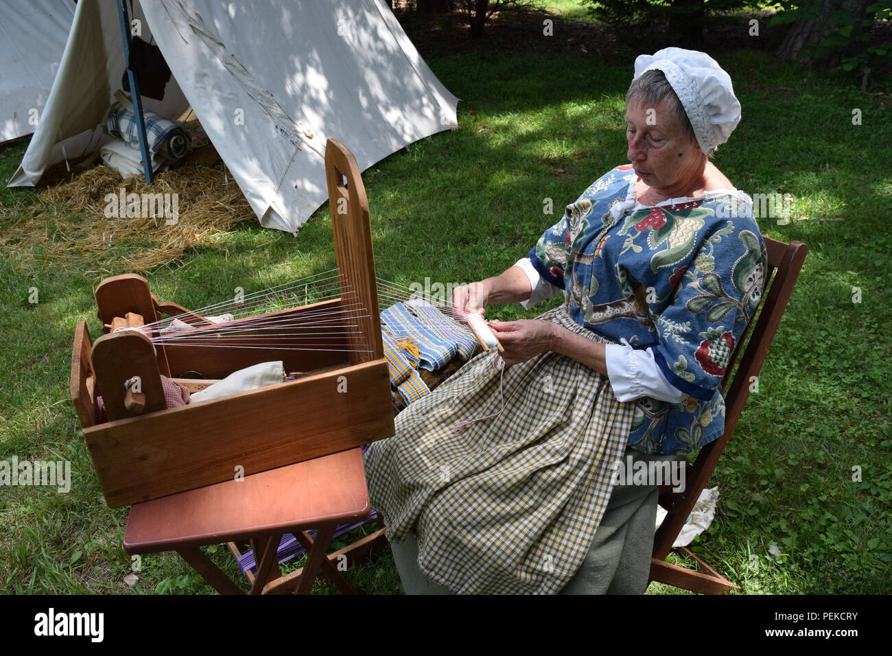 Colonial hand weaving loom demonstration hi-res stock photography and ...