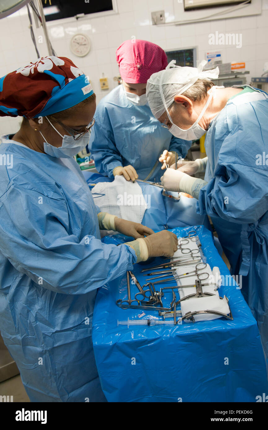 Medical Team Performing Surgical Operation in Bright Modern Operating ...
