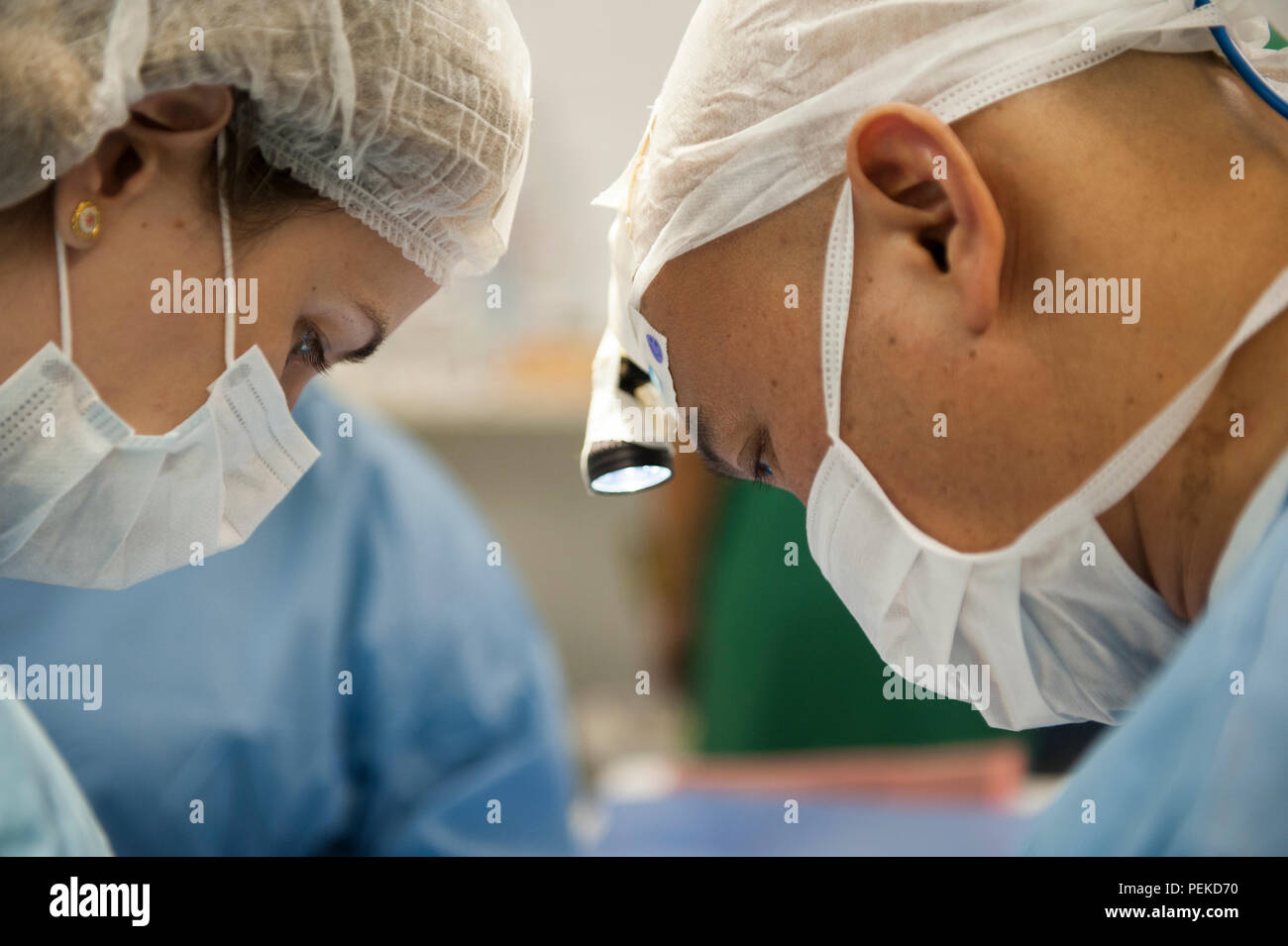 Medical Team Performing Surgical Operation in Bright Modern Operating ...