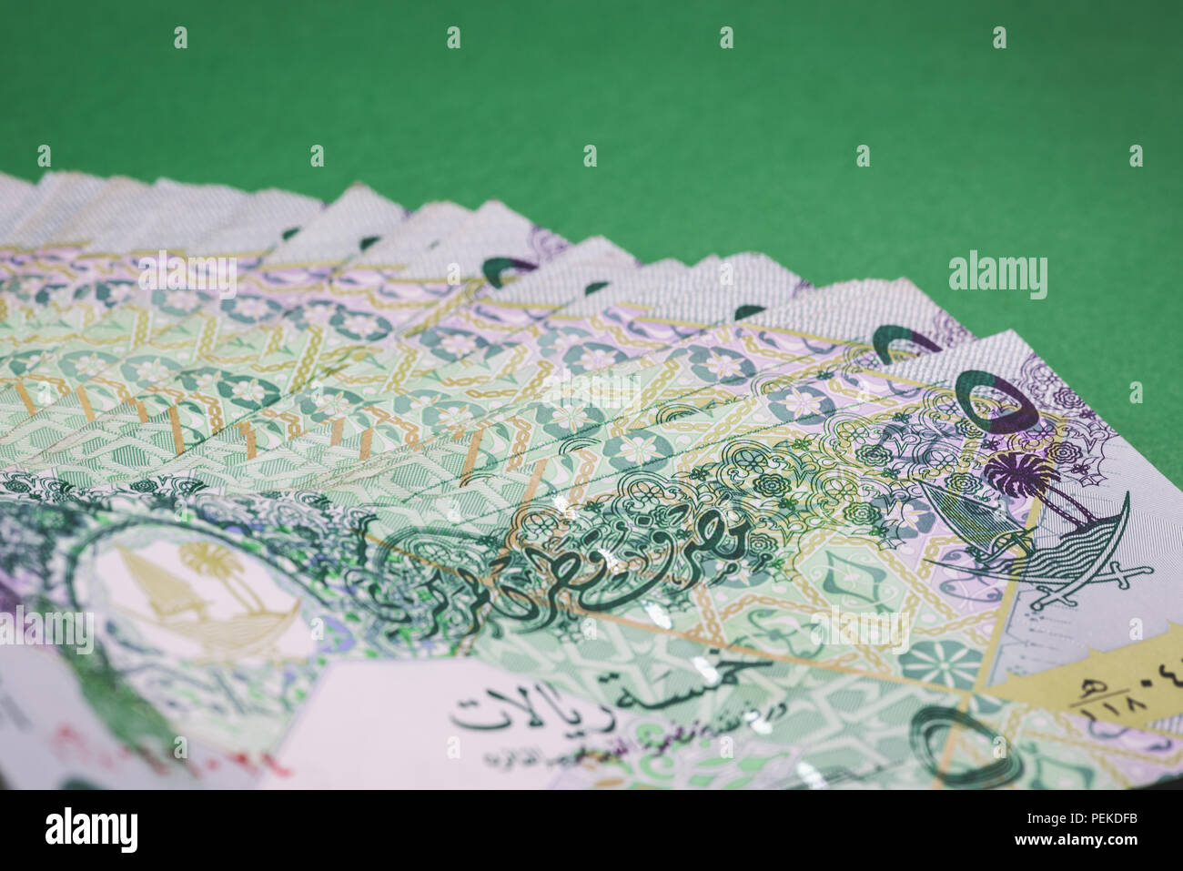 Close up of 5 Qatari Riyal bank note with selective focus Stock Photo ...