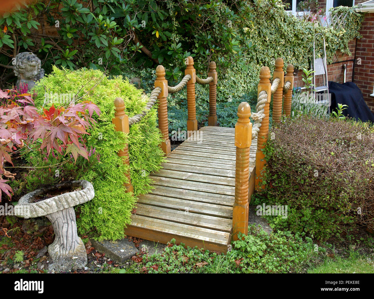 Back garden of English brick built house with conservatory Stock Photo ...
