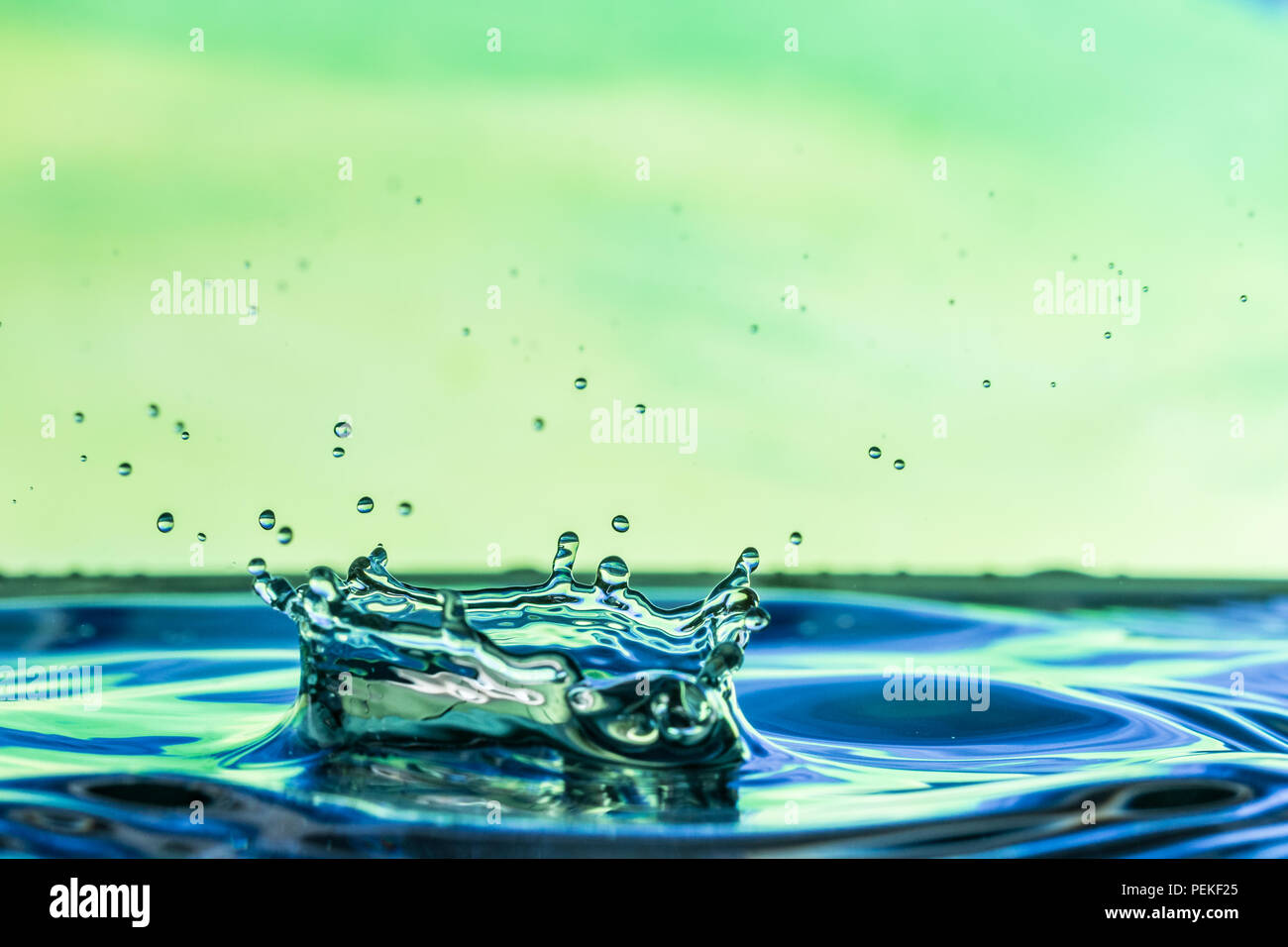 water drop falling on the water surface and forming a crown Stock Photo ...
