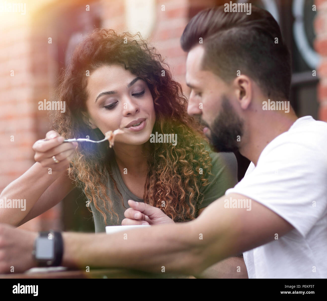 Portrait of lovely romantic couple sitting in a cafe with coffee Stock ...