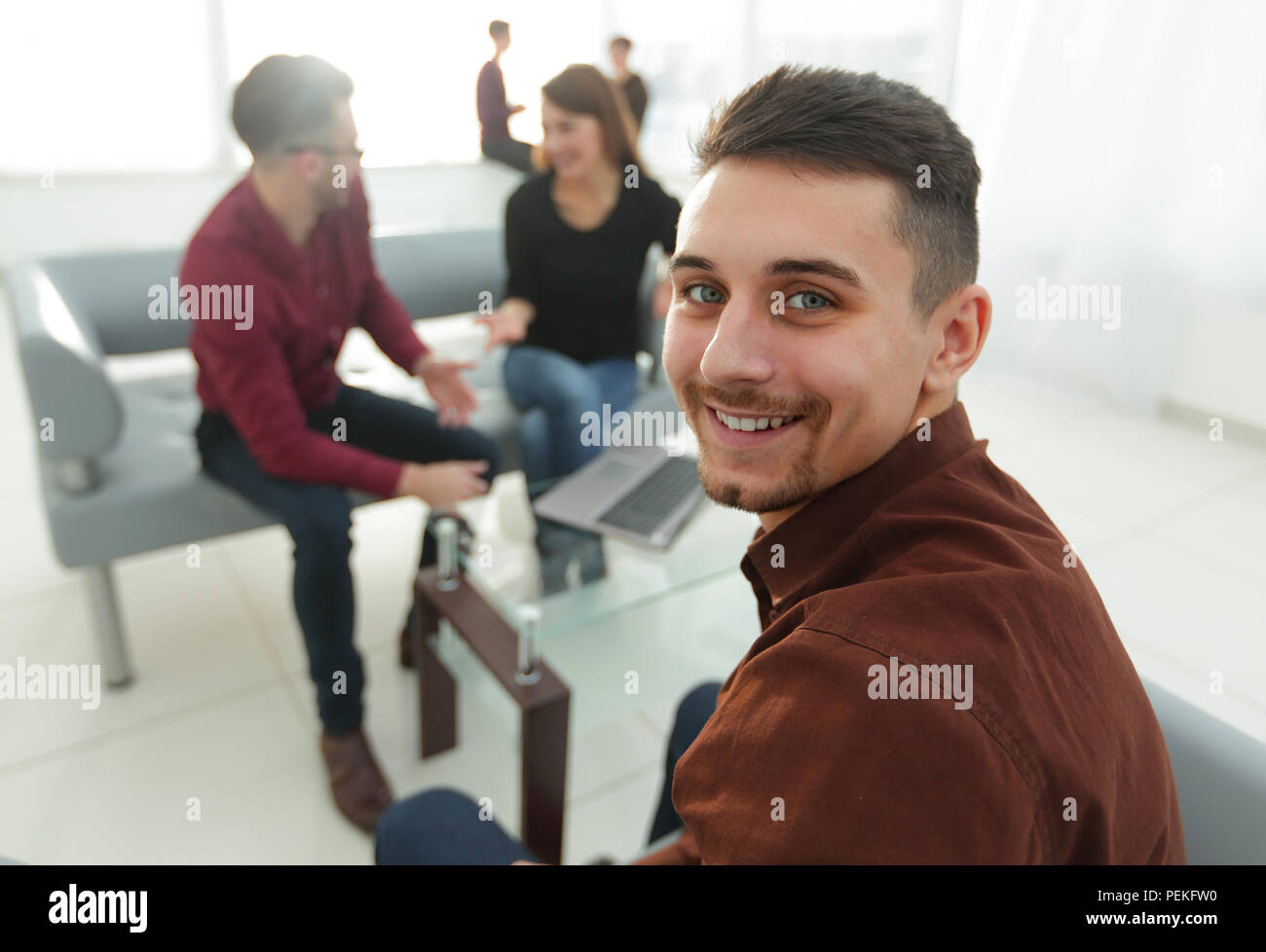 client on the background of the Bank's employees Stock Photo - Alamy