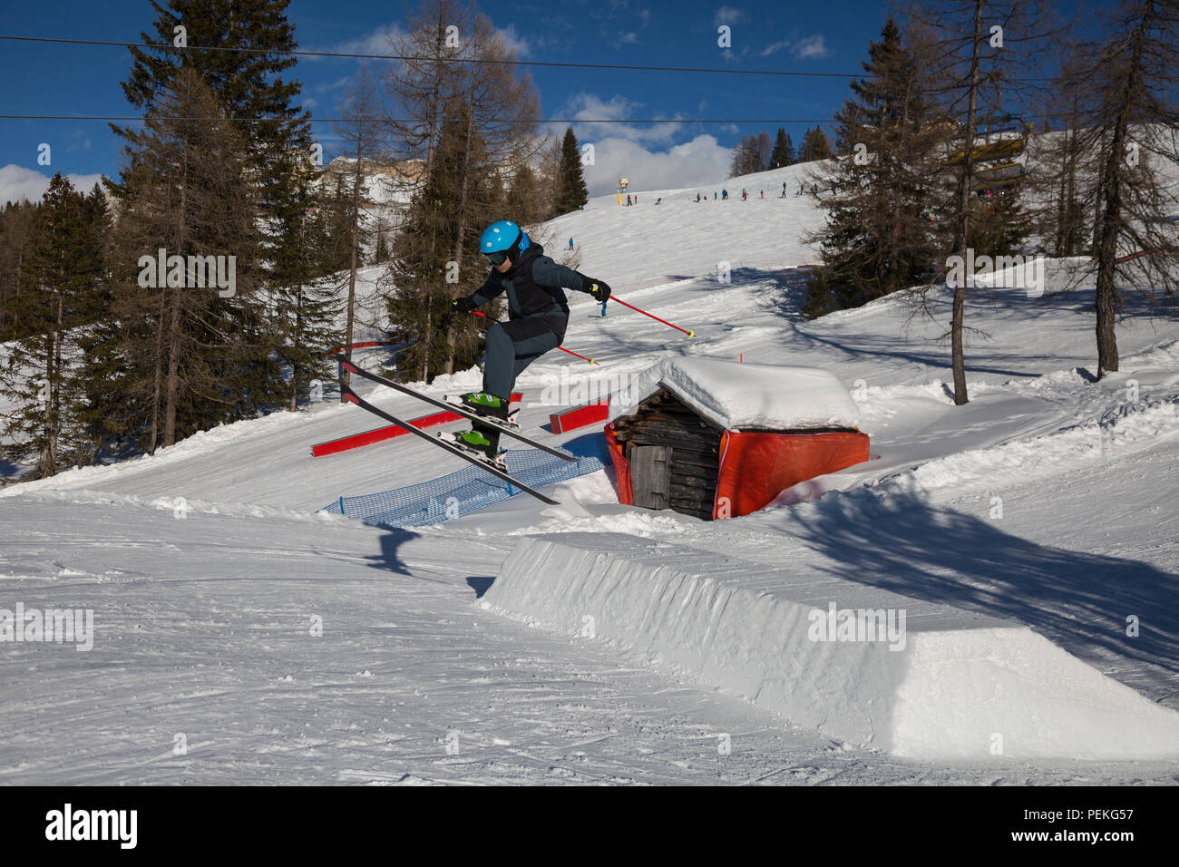 Skier in Action: Ski Jumping in the Mountain Snowpark Stock Photo - Alamy