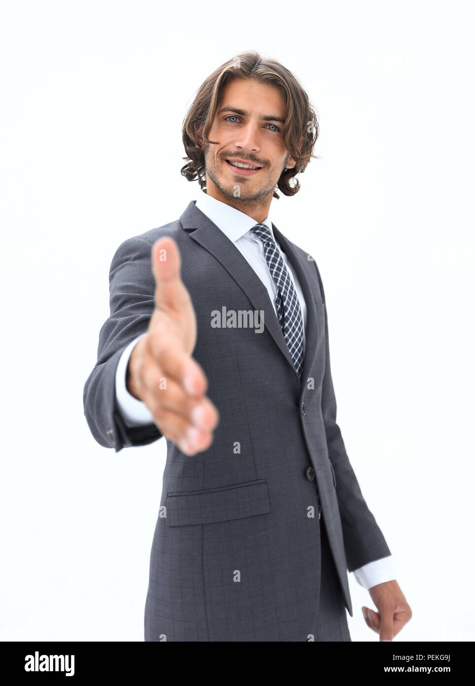 Smiling friendly businessman offers a handshake Stock Photo - Alamy