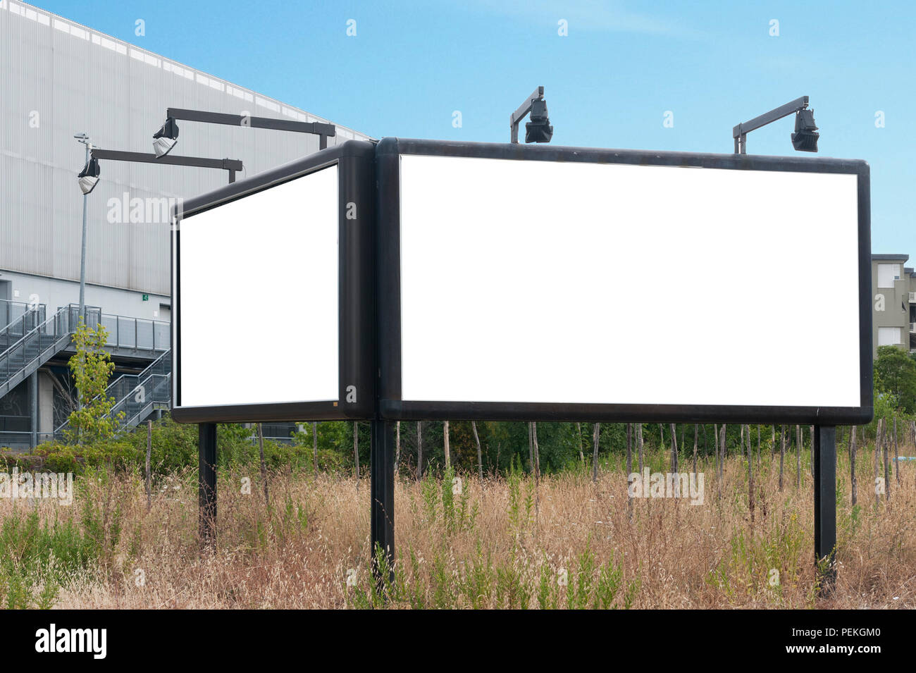 Blank billboard with lights in a field Stock Photo - Alamy