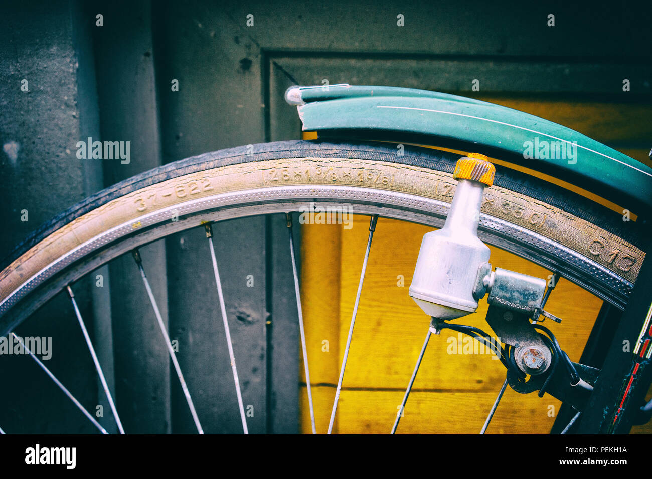 Detail of a vintage bicycle wheel and dynamo Stock Photo - Alamy