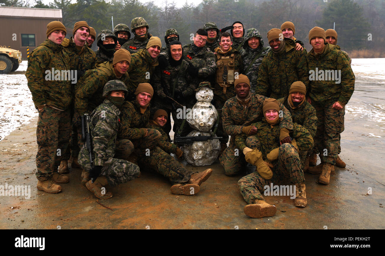 ROK and U.S. Marines pose with a snowman creatively constructed by both ...