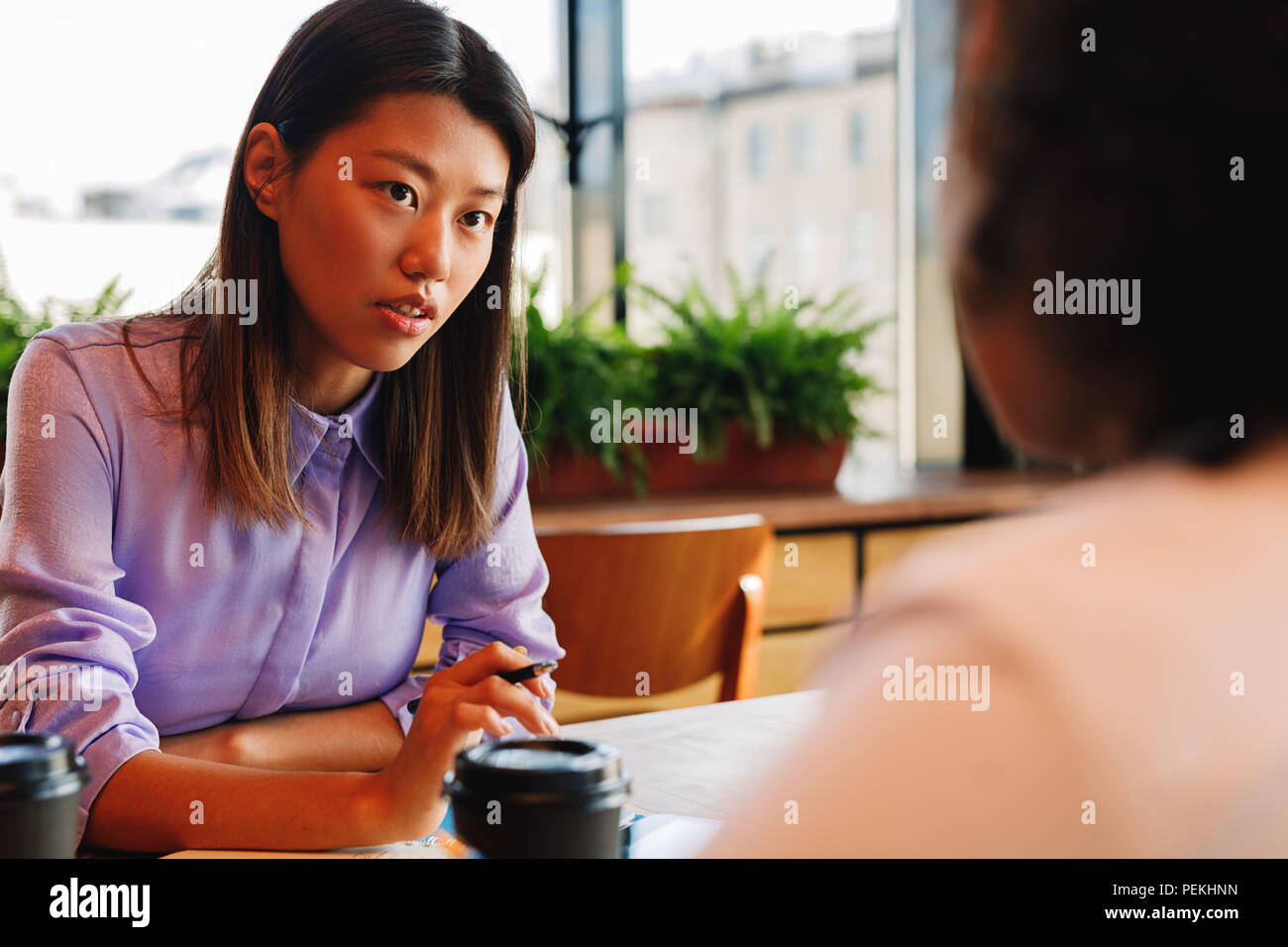 Two business women in a cafe hi-res stock photography and images - Alamy