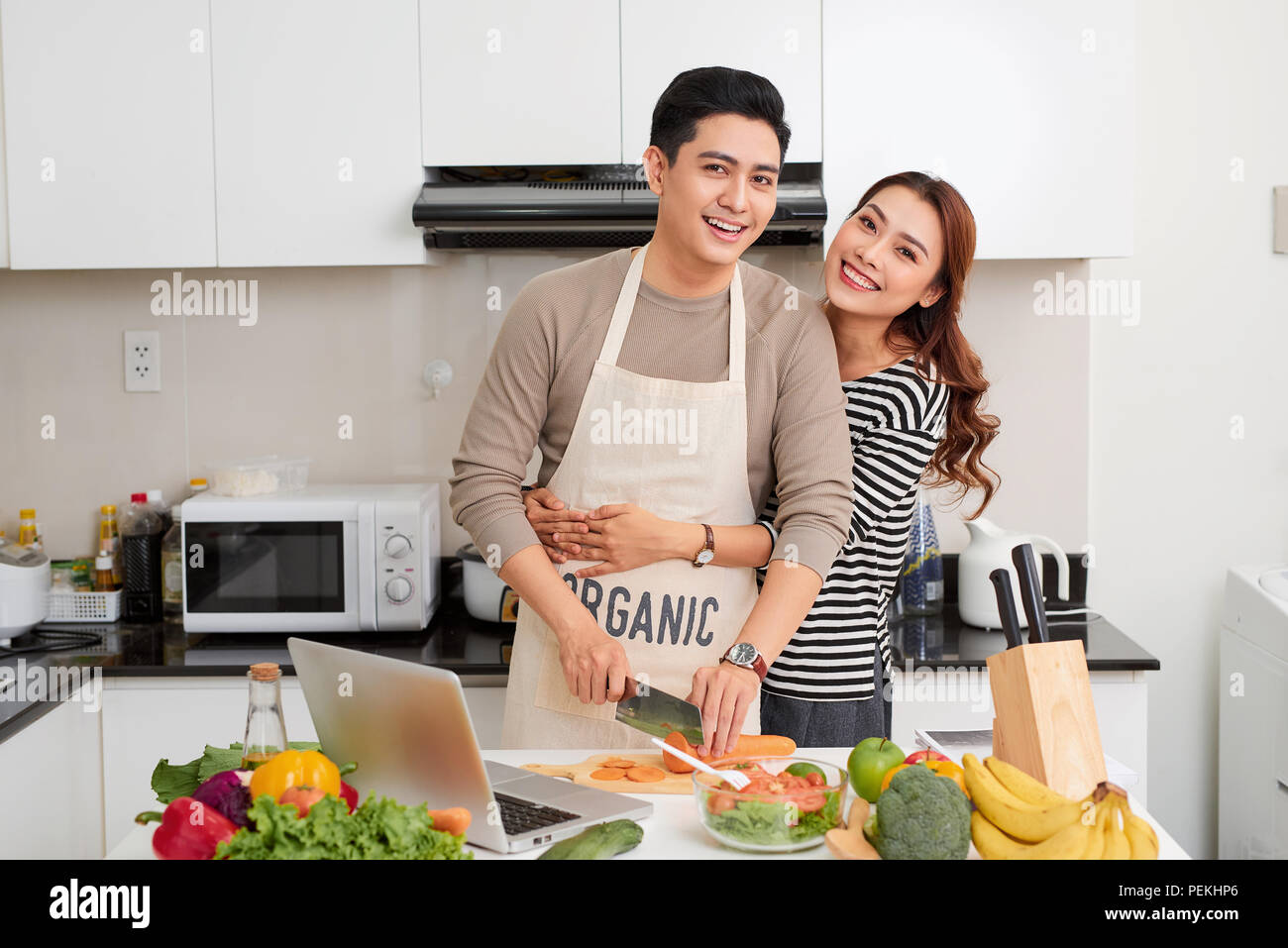 Beautiful couple hugging in kitchen hi-res stock photography and images ...