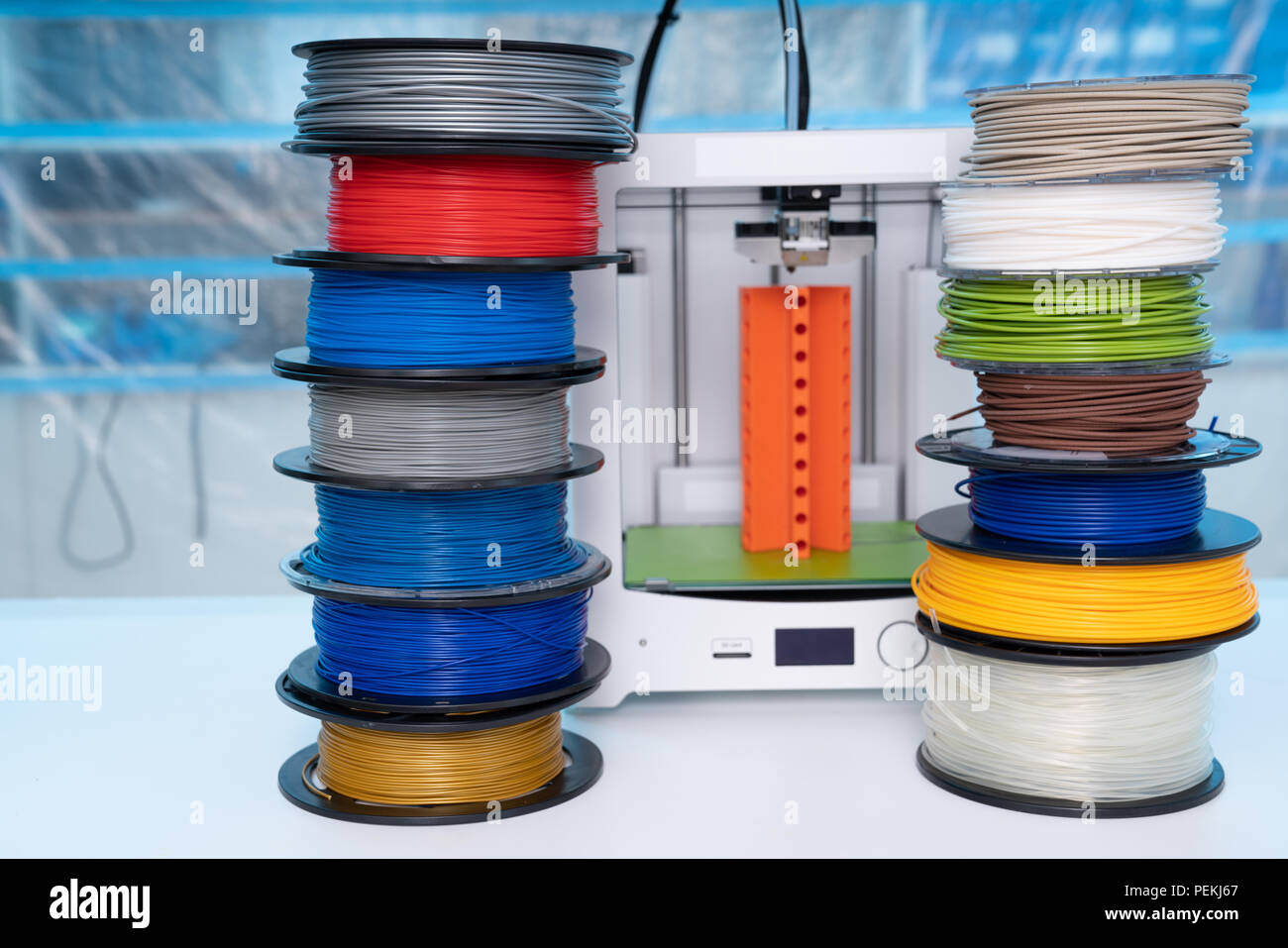ABS and PLA filament next to 3D Printer. Plastic coils Stock Photo - Alamy