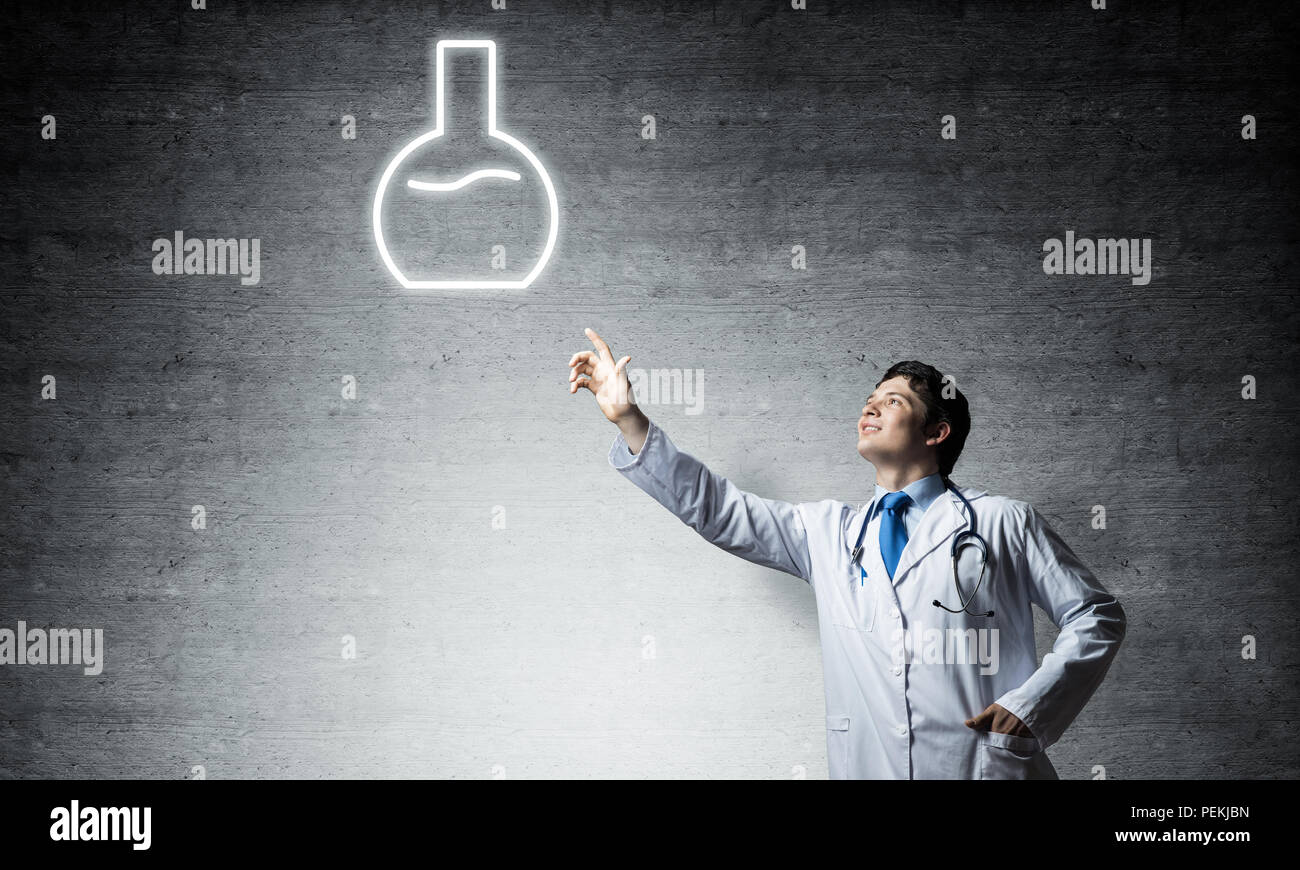 Doctor and vial symbol Stock Photo - Alamy