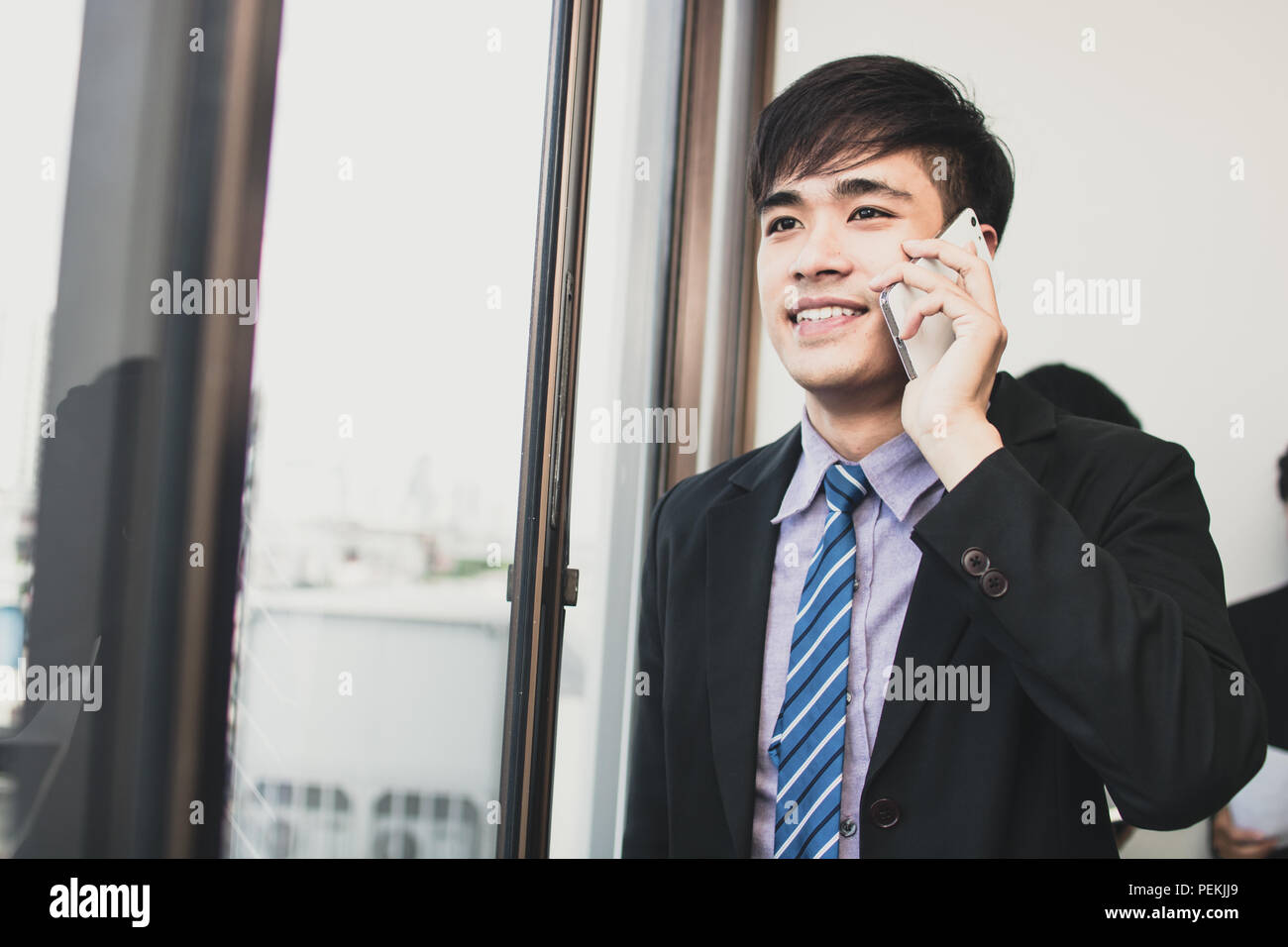 Asian man talking hi-res stock photography and images - Alamy