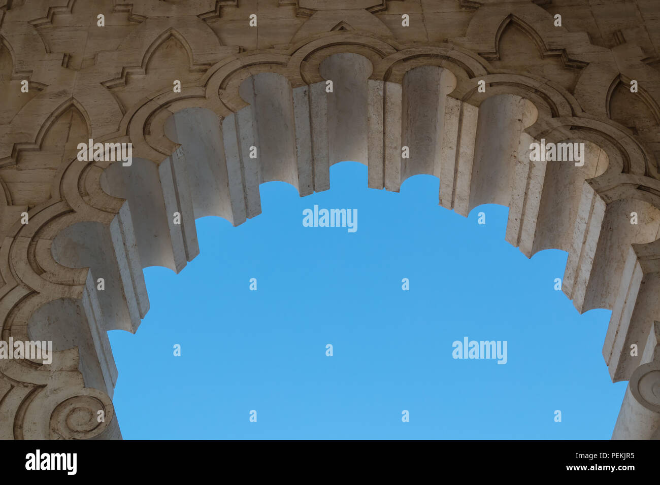 Detail of the arch of the stone ornate gate. Mausoleum of Mohammed V ...