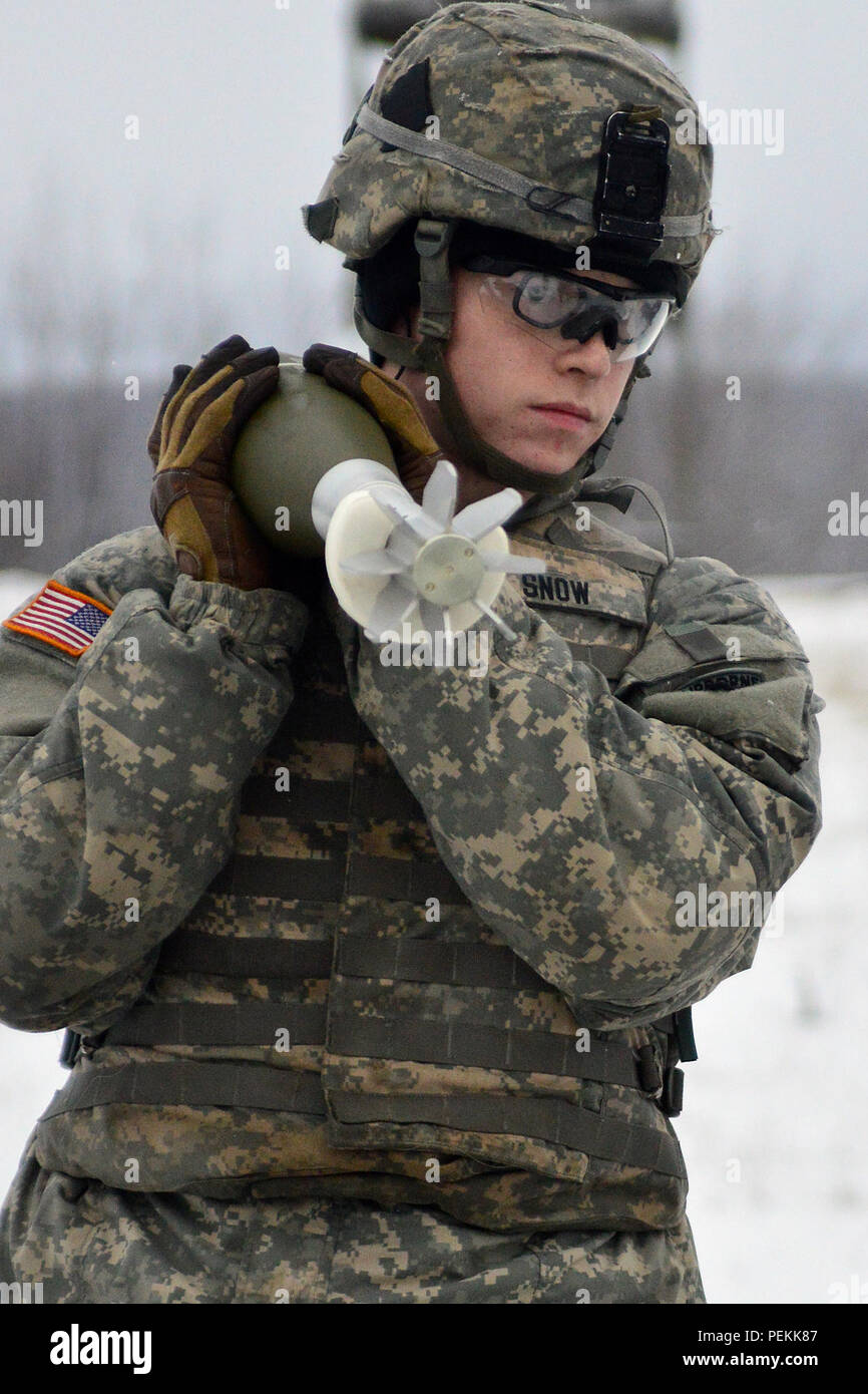 Spc. Thomas Snow stands ready with a 120 mm mortar during training Jan ...