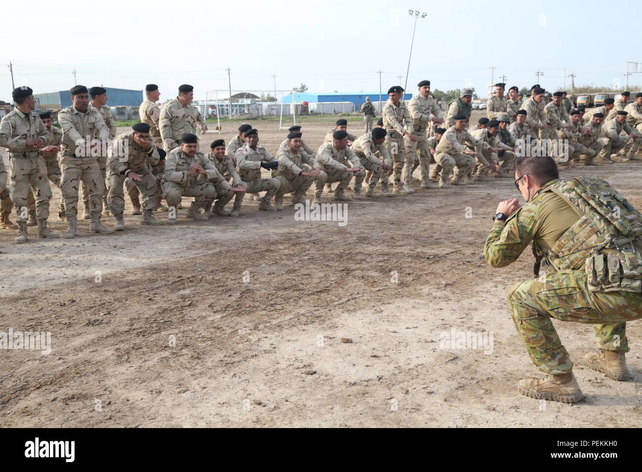 An Australian soldier, assigned as a Task Group Taji Trainer, warms up ...