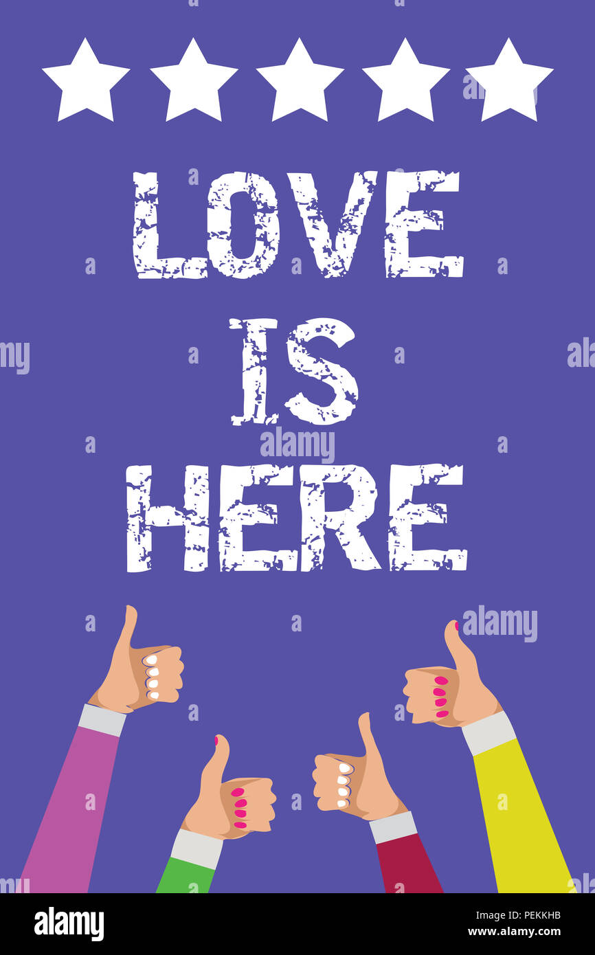 Text sign showing Love Is Here. Conceptual photo Romantic feeling ...