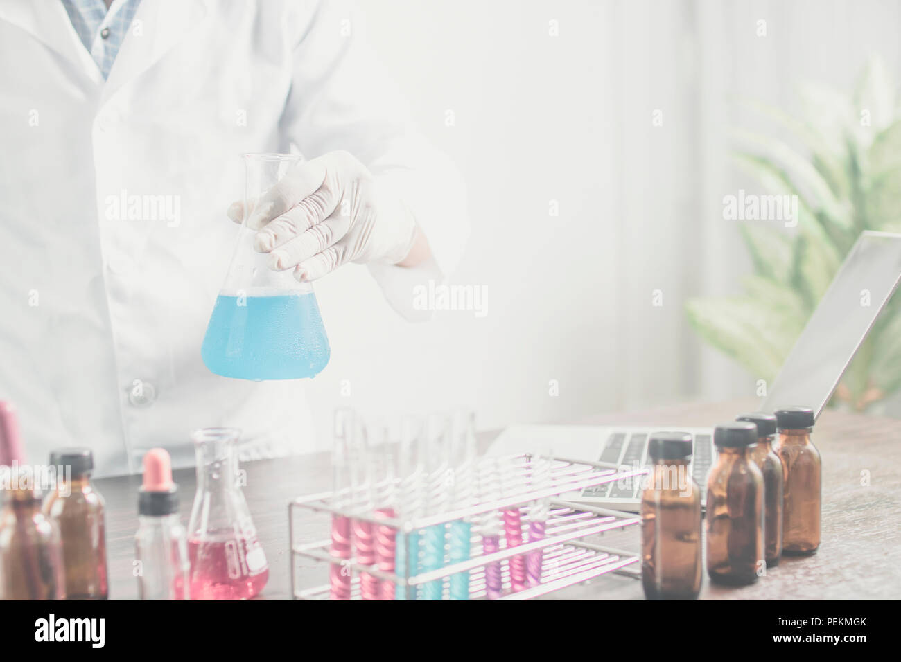 Scientist hand holding flask in hi-res stock photography and images - Alamy