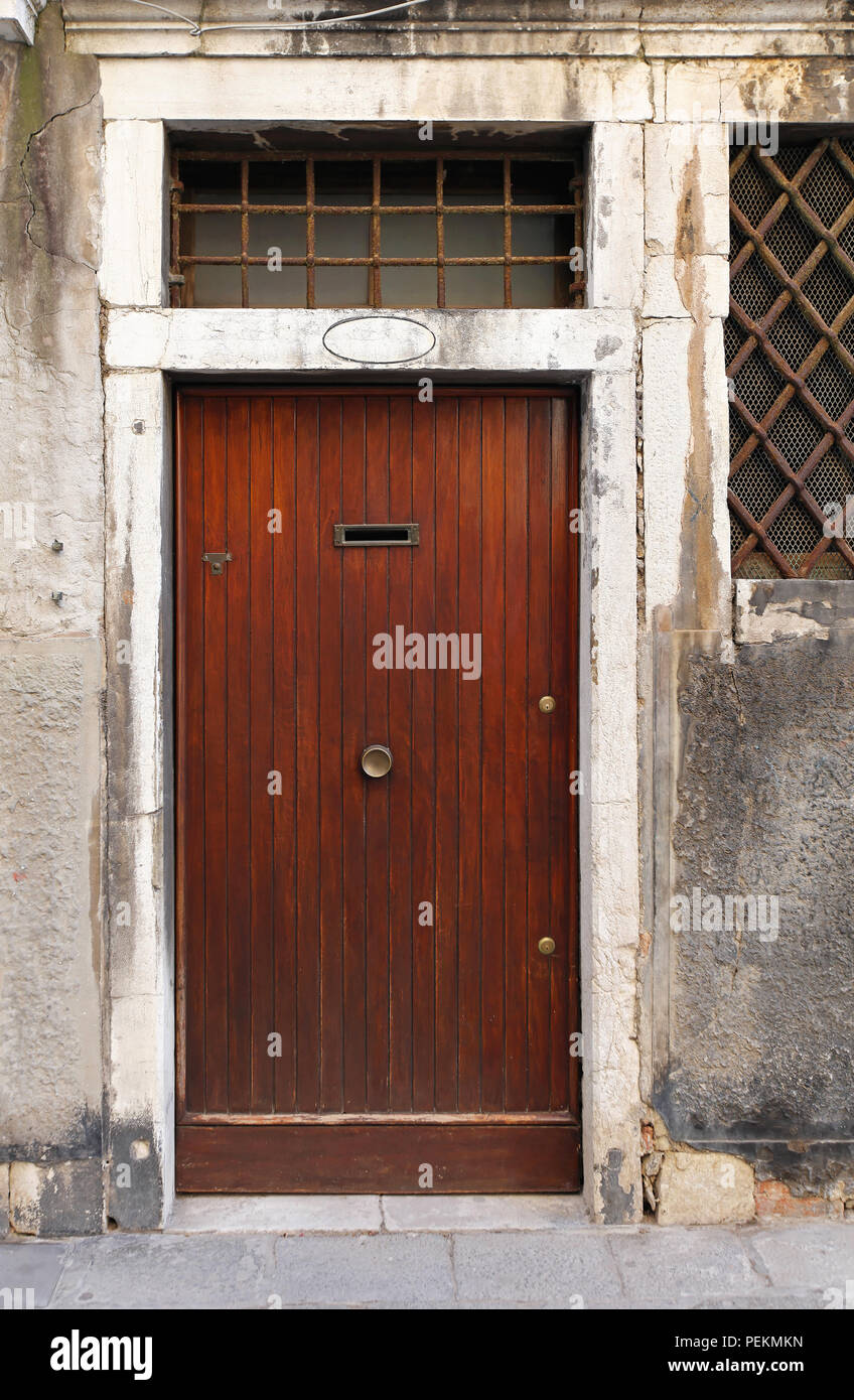 Traditional wooden door at house in Venice Stock Photo - Alamy
