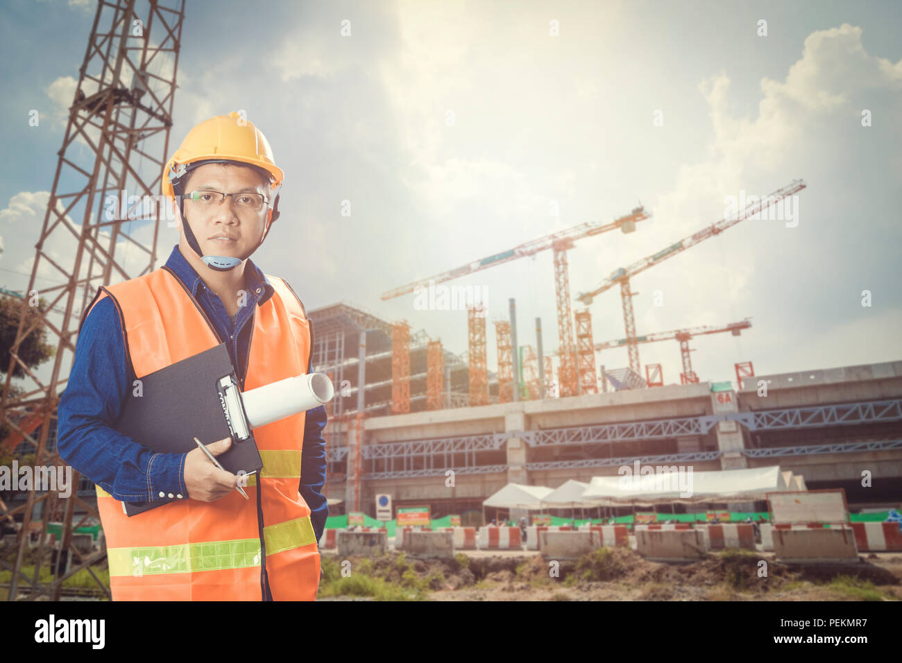 smart engineer on construction site with big building background Stock ...