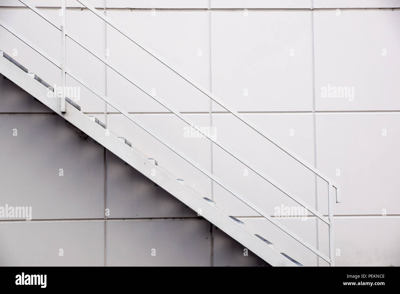 steel factory ladder, fire exit ladder in front of silver metal sheet ...