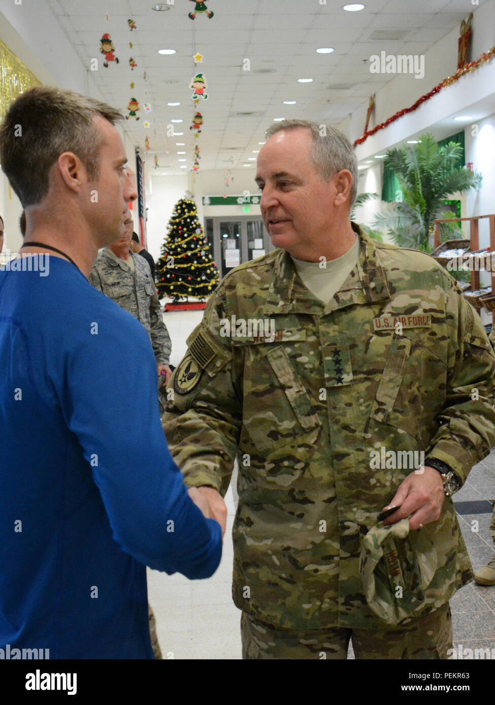 Gen. Mark Welsh III, chief of staff of the Air Force, greets a deployed service member in the ...