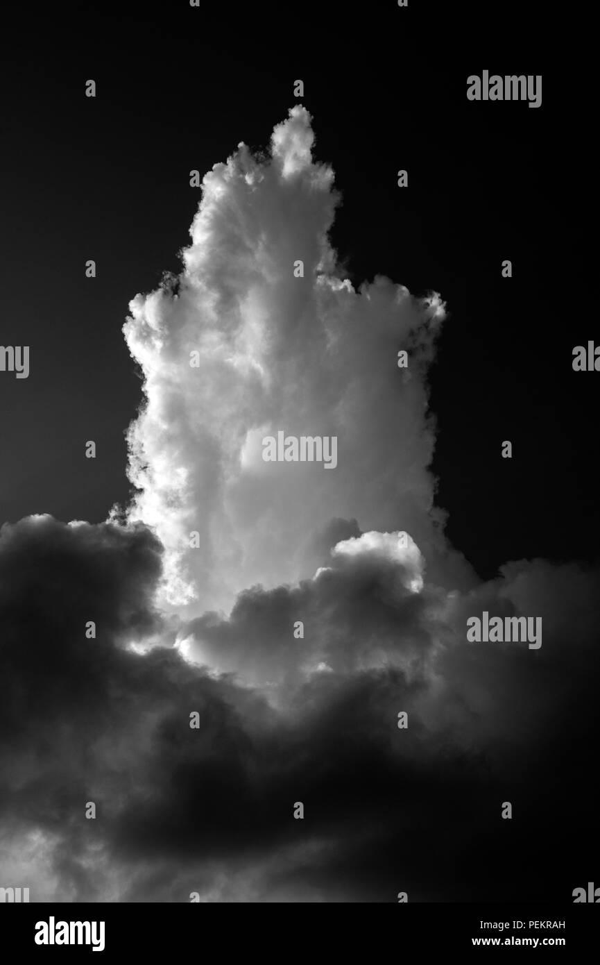 Cumulus clouds with vertical growth creating dramatic cloud shapes ...