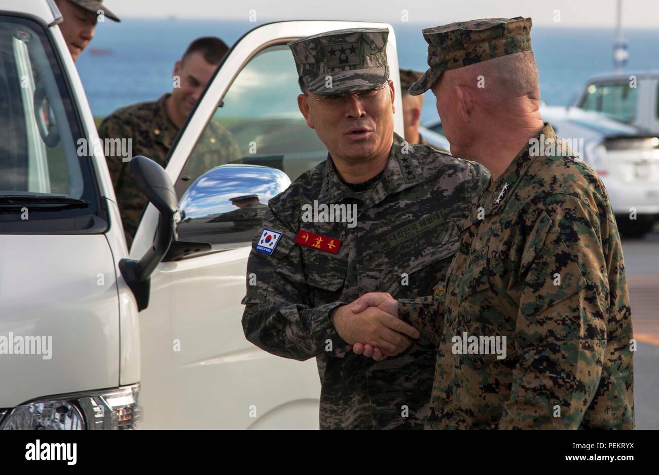 Lt. Gen. Sang Hoon Lee, left, commandant of the Republic of Korea ...
