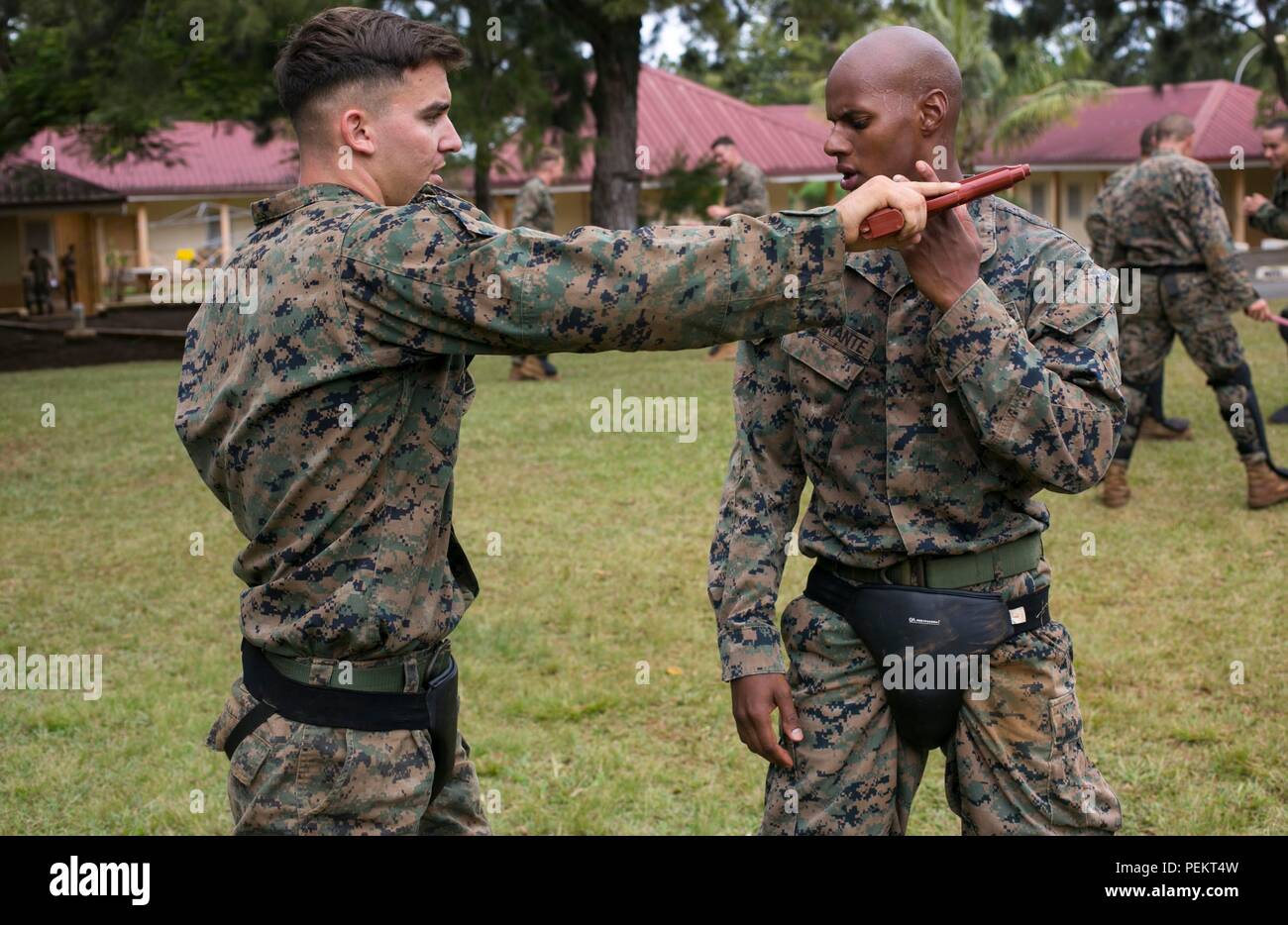 U.S. Marine Corps Lance Cpl. Warren Giller, left, an automatic rifleman ...