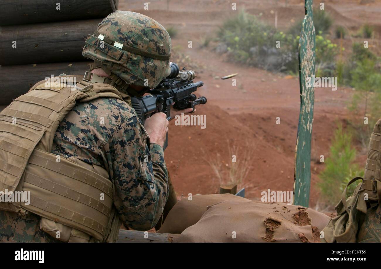 U.S. Marine Corps Lance Cpl. John Avery, an automatic rifleman, with ...