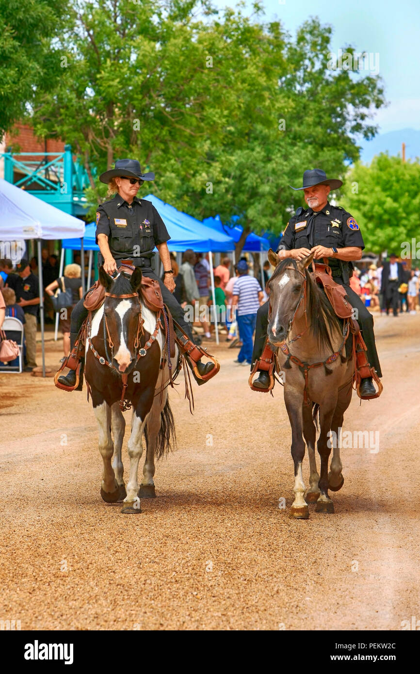 Two Arizona Rangers on horseback ride along E Allen St at the annual ...