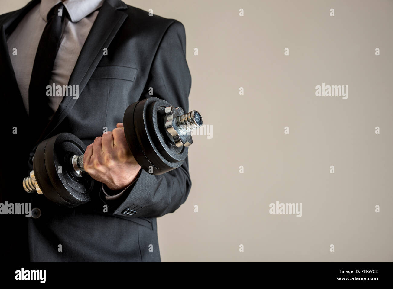 Businessman lifting weights hi-res stock photography and images - Alamy