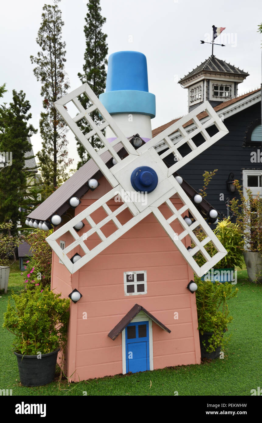 Small wooden mill standing on the fresh green grass Stock Photo - Alamy