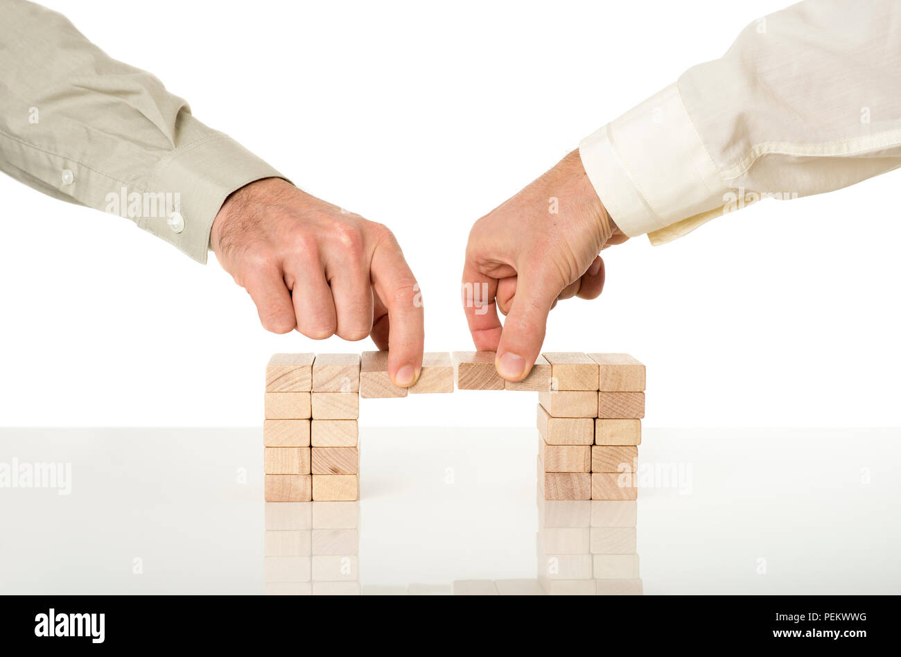 Conceptual image of business merger and cooperation - two male hands ...